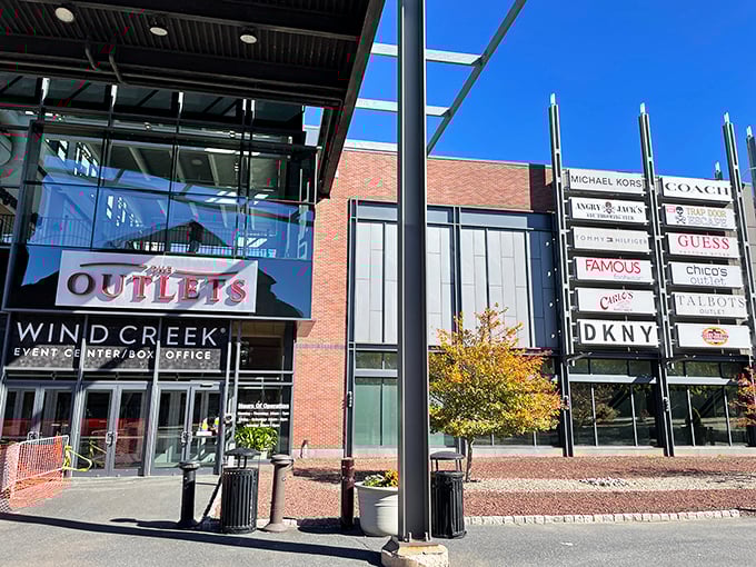 Industrial chic meets shopping paradise where steel beams frame dreams of designer deals and wallet-friendly finds.