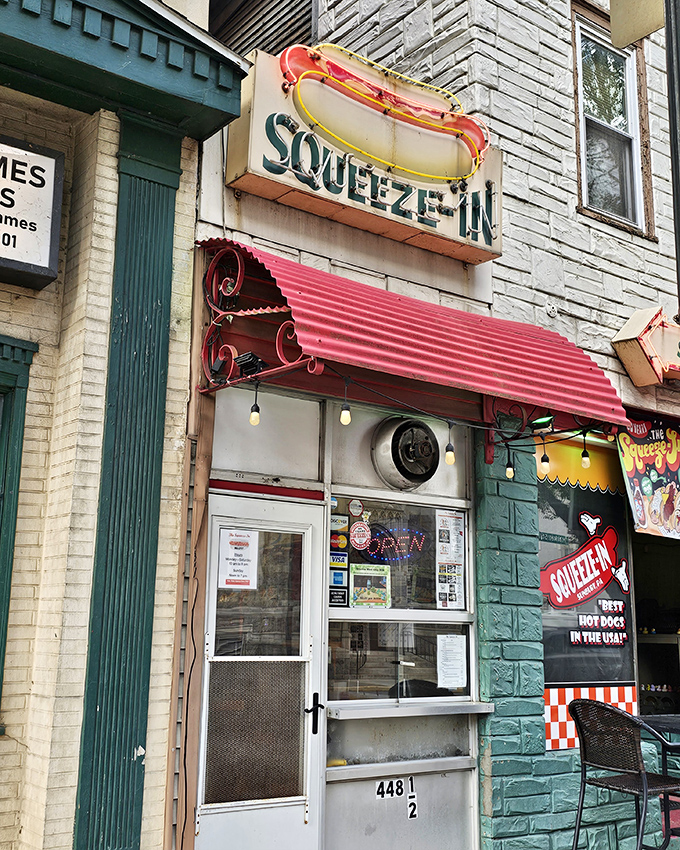 The neon hot dog sign is just the beginning of the story. This sliver of a restaurant proves greatness requires skill, not square footage.