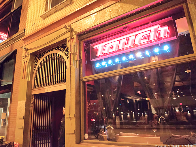 Touch Supper Club's dramatic neon glow transforms Cleveland's Lorain Avenue into a beacon for serious food lovers.