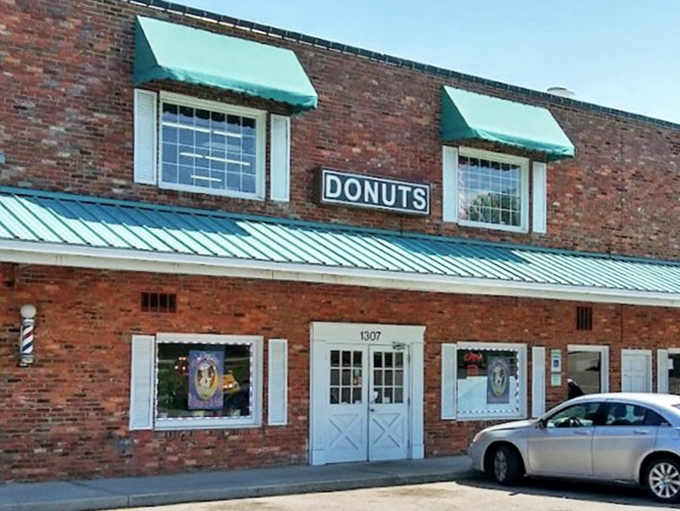 Green awnings frame sweet dreams where Baker's Dozen keeps the neighborhood tradition alive and delicious. 