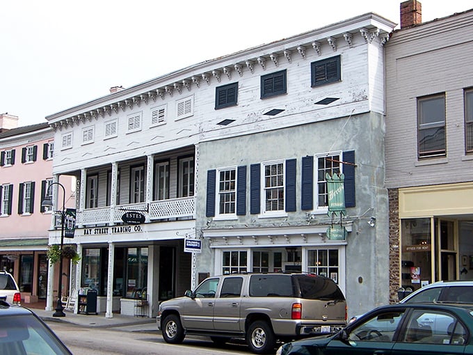 Old-style front creates picturesque curtains while historic homes watch over tranquil harbor waters.