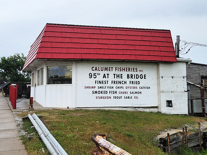 That red roof shelters smoking traditions that turn ordinary fish into extraordinary experiences.