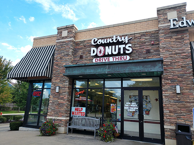 The classic Country Donuts building stands ready to satisfy sweet cravings morning or night. Those black and white awnings mean business!