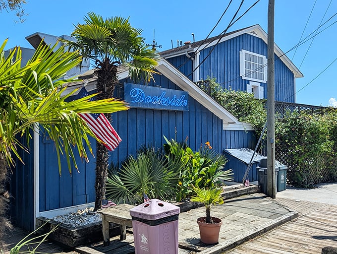 Palm trees and blue siding create the perfect backdrop for your next seafood adventure.