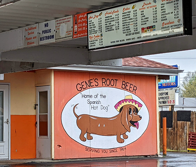 The "Spanish Hot Dog" mascot at Gene's has been making drivers smile (and hungry) for decades. Classic drive-in culture preserved in all its glory.