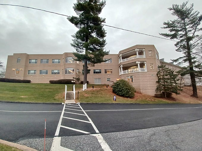 Solid brick construction and mature trees suggest this community has weathered many seasons with grace.