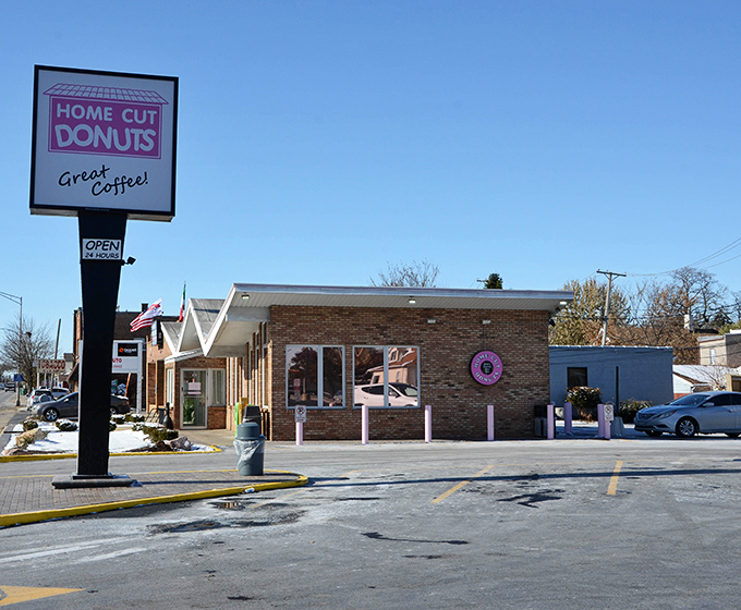 That welcoming sign and cozy building promise the kind of donuts that make mornings worth celebrating.