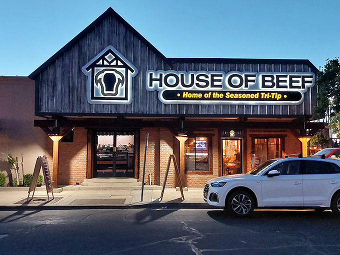That rustic exterior promises the kind of steakhouse where portions match the building's generous proportions.