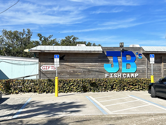That bold blue signage against weathered wood screams "authentic fish camp" louder than any marketing campaign ever could.
