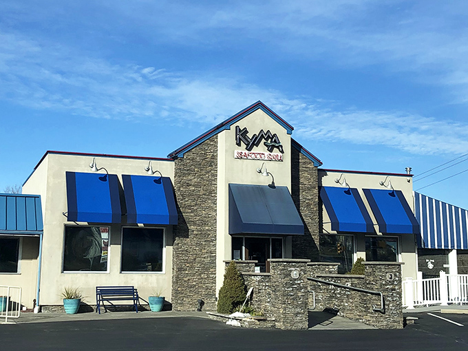 Blue awnings and clean lines suggest Mediterranean influences have found their Pennsylvania home beautifully.