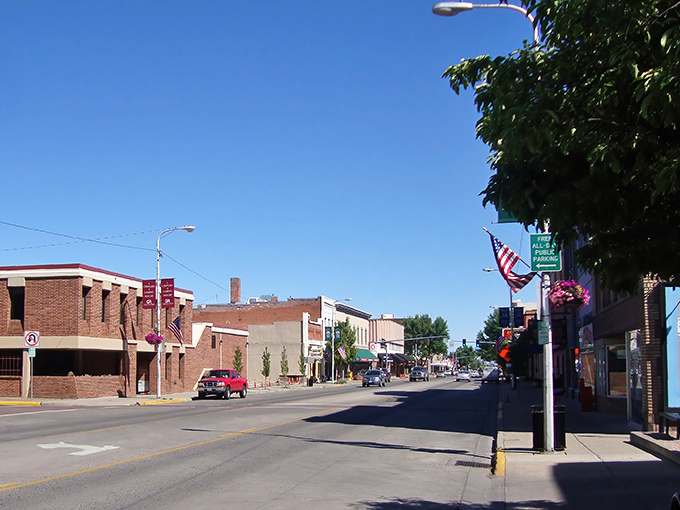 Sunny blue skies welcome you to downtown La Grande, where charming brick buildings and American flags line your peaceful walk.