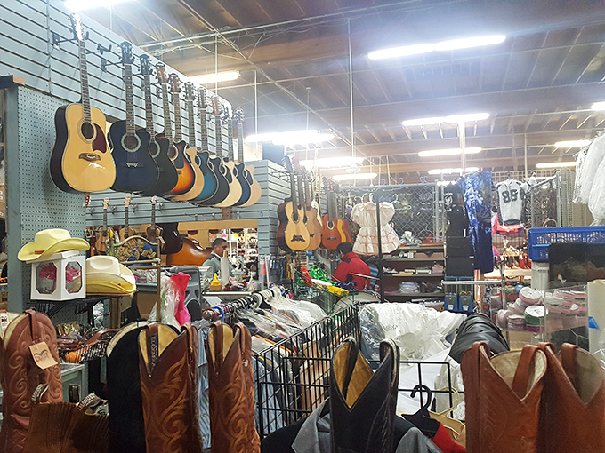 Guitars hang like ripe fruit waiting to be picked at La Pulga Fant&aacute;stica. Someone's next musical journey starts with these strings!