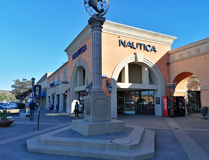 Spacious outdoor walkways invite exploration while mountain views remind you why California shopping feels magical.