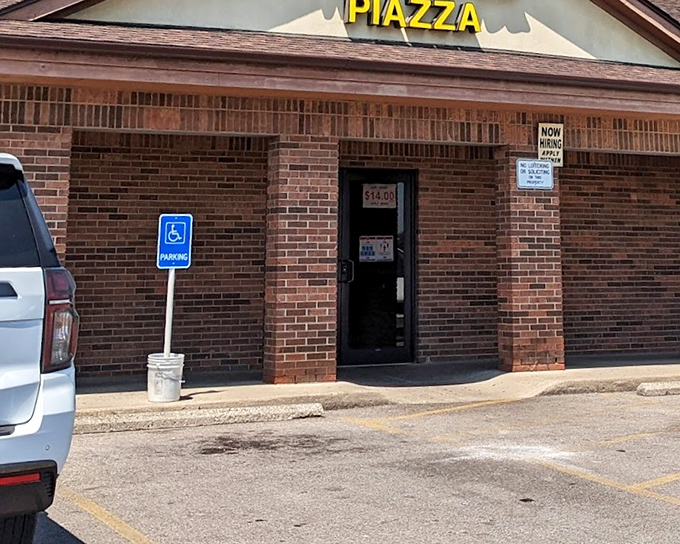 That unassuming brick exterior conceals Dayton's most beloved square-cut pizza tradition inside.