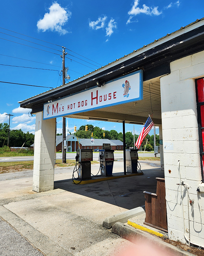 The American flag flutters proudly beside Ma's Hot Dog House. Those vintage gas pumps haven't worked in years, but the grill sure does!