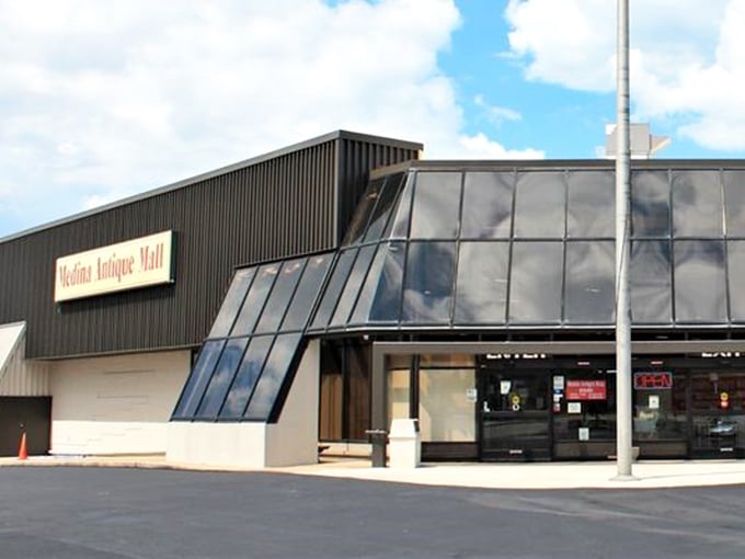 The slanted glass windows hint at the bright discoveries waiting inside this antique treasure trove.