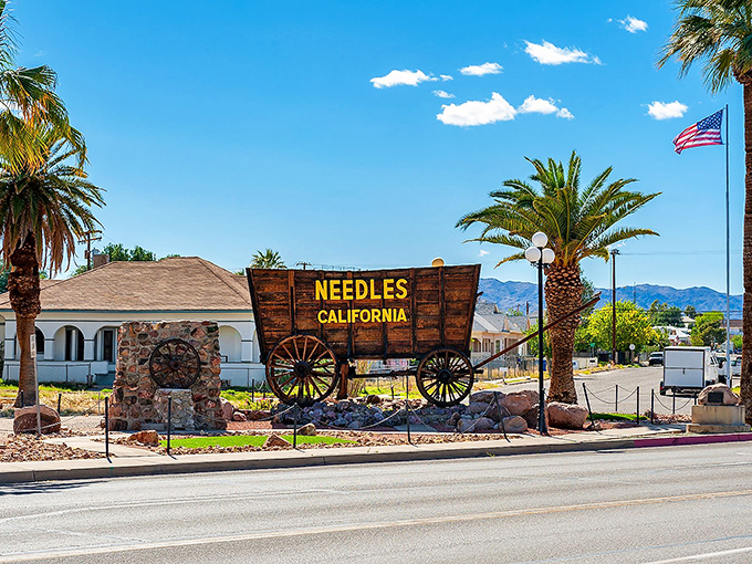 The famous Needles sign points toward adventure, affordable living, and legendary Route 66 history.