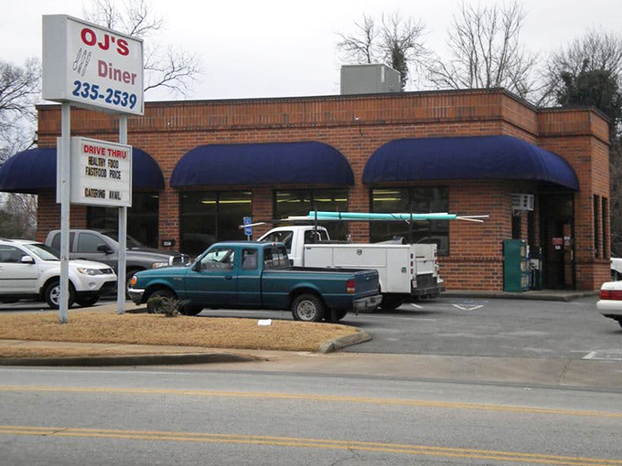 Blue awnings and brick walls create the perfect backdrop for serious comfort food conversations.