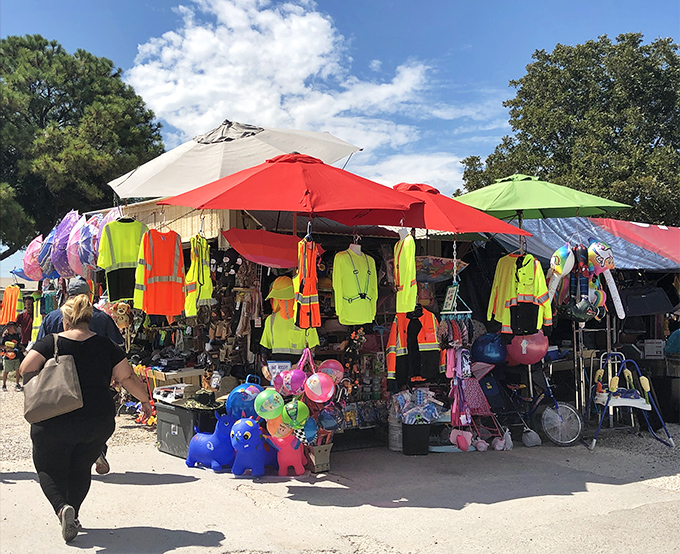 Rows of jeans and colorful shirts await new owners at Pearland Flea Market. Sometimes the perfect fit is hiding at a folding table under a tent!