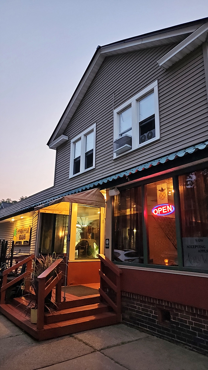 As dusk settles, Pineapple Eddie's warm lights promise southern comfort far from the Mason-Dixon. Their fried chicken makes geography irrelevant.