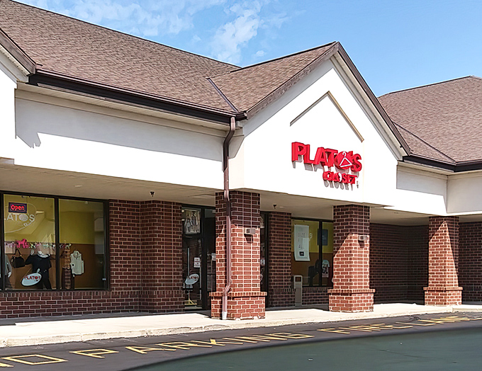 That sleek storefront whispers "designer deals inside" to young fashionistas hunting for name-brand bargains.