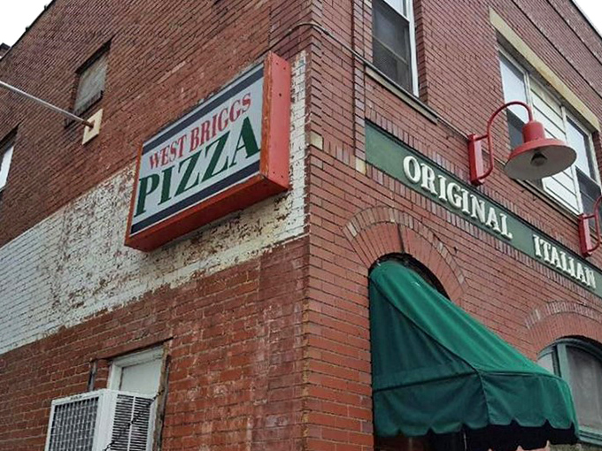 Red brick, green awnings, and pizza that should be illegal &ndash; the perfect crime of flavor hiding in plain sight.