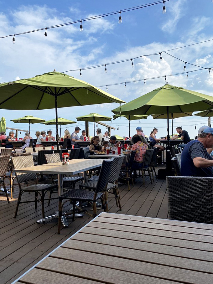 Those green umbrellas aren't just for shade - they're beacons calling beach lovers to their happy place. 