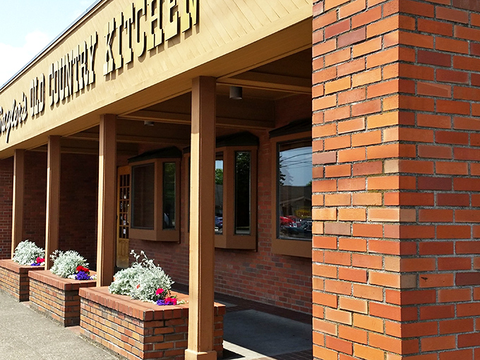 The classic brick and neon combo screams old-school steakhouse charm from every angle.