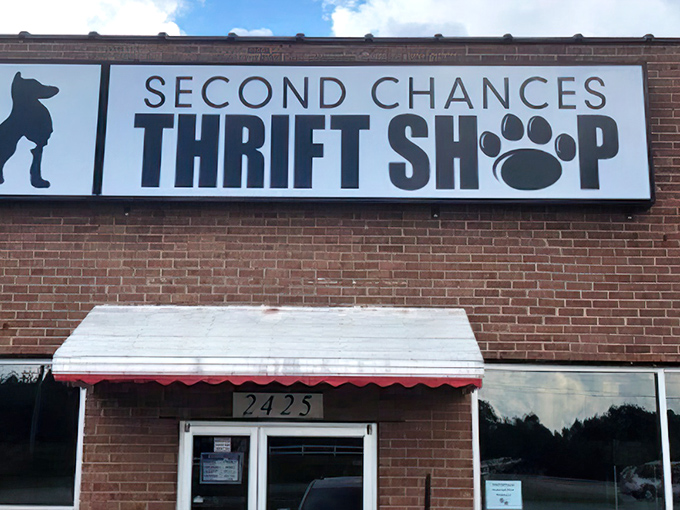 The red awning creates a cheerful entrance where community spirit meets incredible deals on quality donated goods.