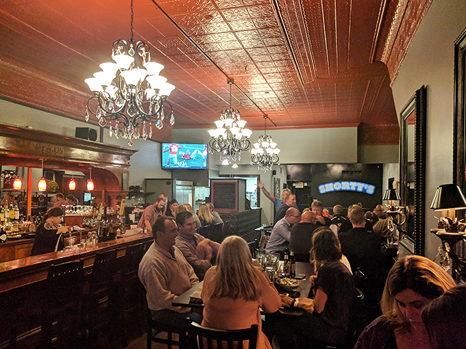 Crystal chandeliers and comfortable seating create the perfect atmosphere for savoring exceptional steaks with good friends.