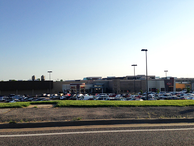 Classic cars gathering outside hint that this shopping center has been making memories for generations.