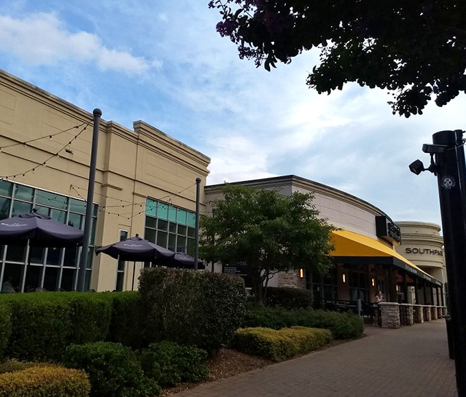 Manicured landscaping frames this shopping destination like a beautiful picture, inviting leisurely afternoon retail therapy sessions.