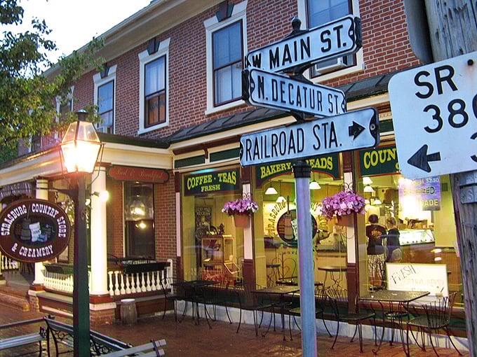 Main Street Strasburg buzzes with evening activity - small town charm meets gentle nightlife under vintage streetlights.