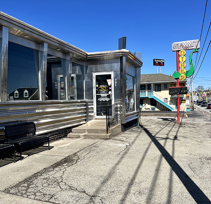 Sunshine bounces off this gleaming diner like it's showing off. The bench outside is for those who need a moment after their epic meal.