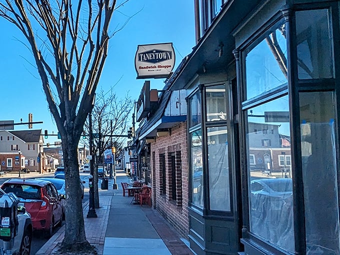 The charming storefront blends perfectly into this historic neighborhood. That small hanging sign is like a secret handshake for sandwich insiders.