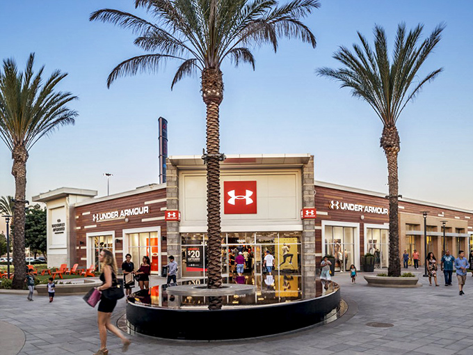 Under Armour's corner spot at The Outlets at Orange practically glows in the California sunshine. Athletic wear that won't break the bank!