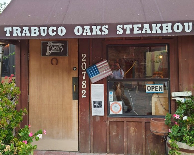 Wooden barrels and country decorations hint at the smoky ribeye perfection waiting inside.
