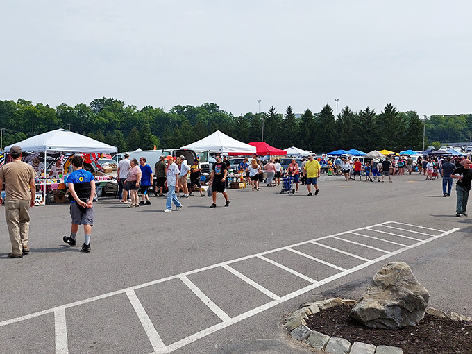 This outdoor bazaar spreads across the asphalt like a pop-up village dedicated to the art of the deal.