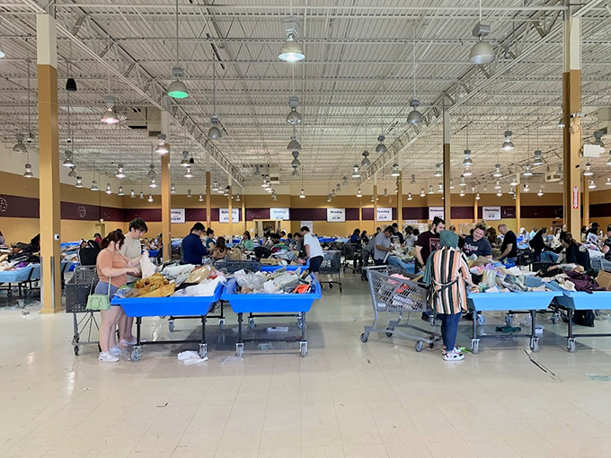 Blue tables create an organized chaos where one person's castoff becomes another's perfect find.