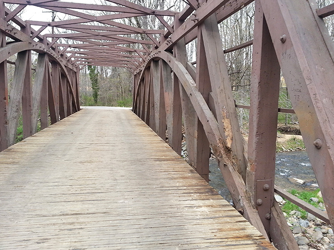 Before its vibrant red makeover, the bridge's structural bones reveal the intricate craftsmanship that's kept it standing since Lincoln was president.