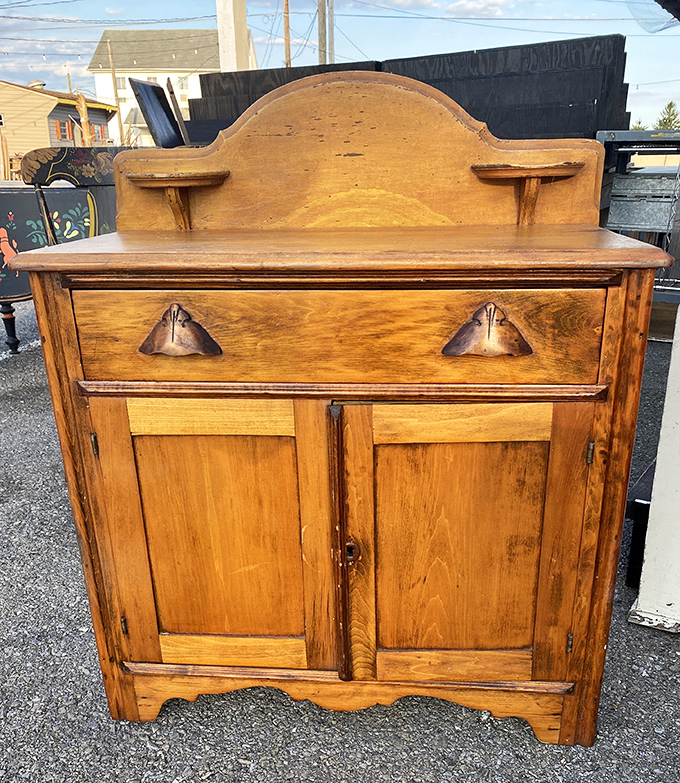 This antique dry sink cabinet has witnessed more family dinners than your favorite sitcom &ndash; its patina telling stories of generations past.
