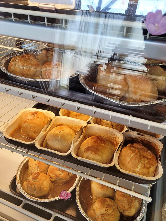 Golden-brown apple dumplings waiting patiently for their forever homes. These aren't just desserts; they're Pennsylvania Dutch comfort in aluminum pans.