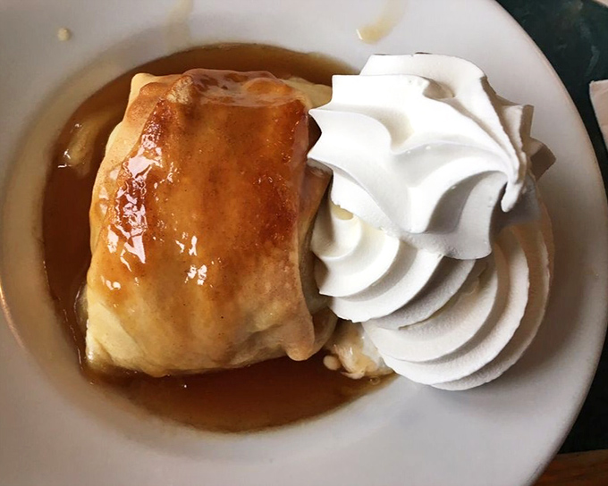 An apple dumpling that doesn't just satisfy your sweet tooth&mdash;it writes it a heartfelt thank-you note. That whipped cream crown is well-deserved.