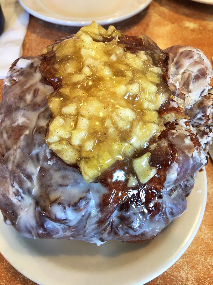 This apple fritter isn't just a pastry&mdash;it's architecture. A cathedral of glazed dough and cinnamon-spiced apples that demands reverent silence before the first bite.