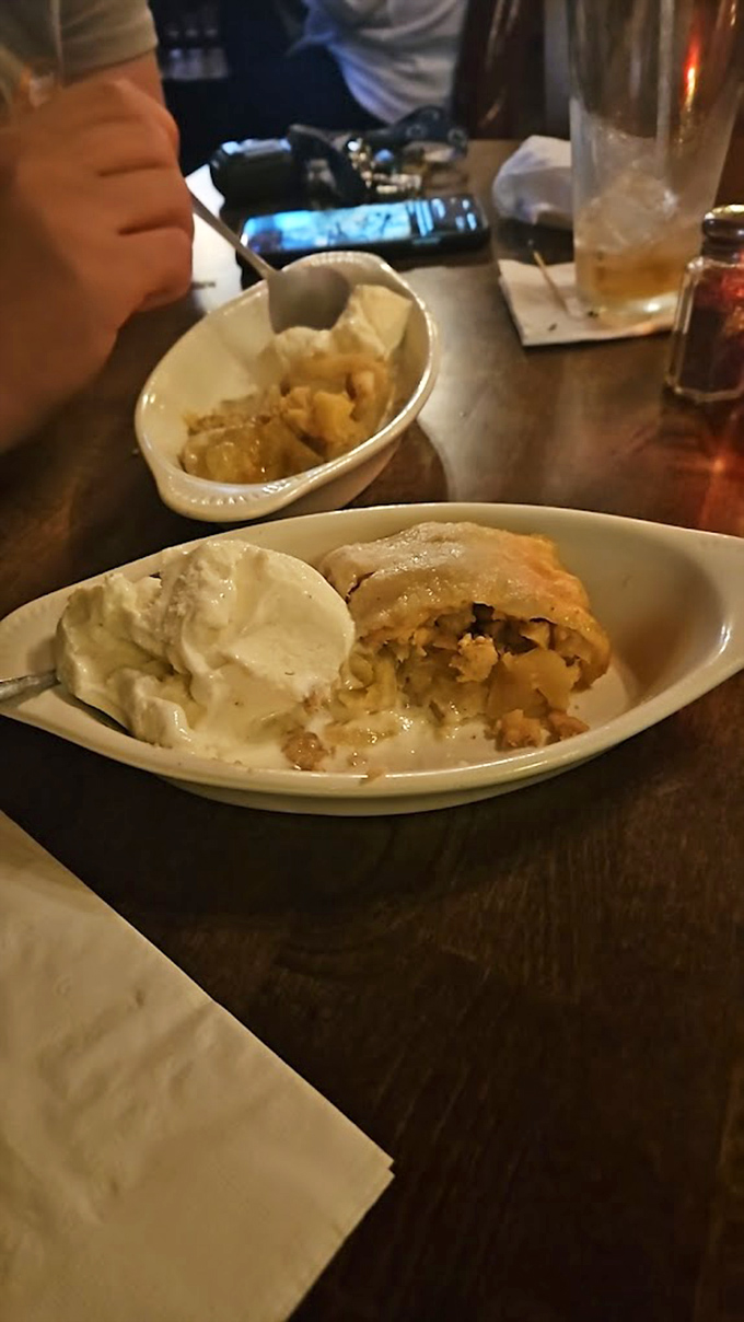 Apple strudel meets Irish hospitality &ndash; warm, cinnamon-scented comfort nestled beside a scoop of vanilla ice cream that's melting just right.
