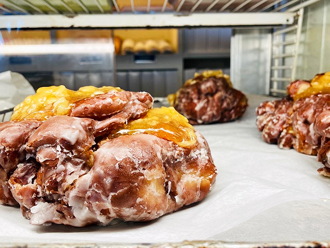 These apple fritters aren't just donuts—they're edible treasure maps of caramelized apple chunks and cinnamon swirls waiting to be discovered.