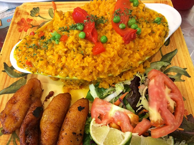 Arroz con pollo that would make your grandmother jealous. That vibrant yellow rice studded with peas and peppers is what comfort food dreams are made of.