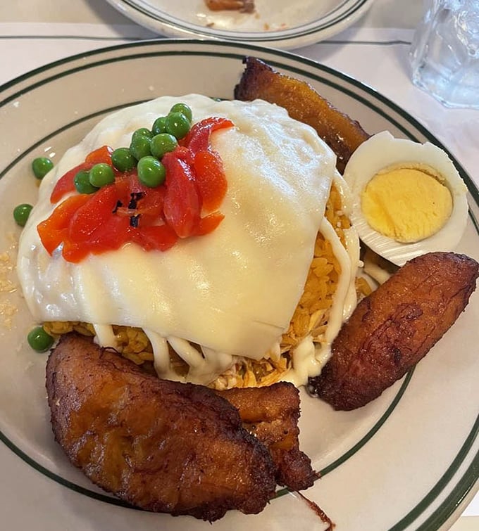 Arroz imperial crowned with melted cheese &ndash; it's comfort food wearing its Sunday best.