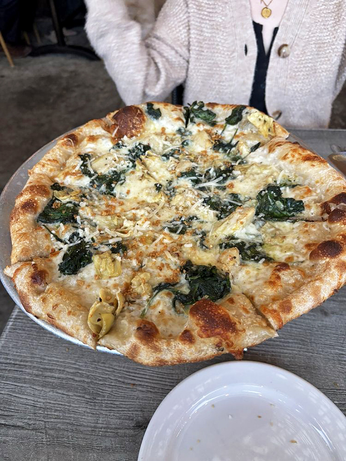 Artichoke pizza that proves vegetables can be just as seductive as any pepperoni could ever dream.