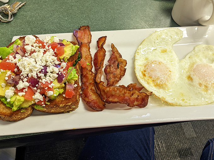Avocado toast that would make a millennial weep with joy, paired with eggs and bacon that would make their parents equally delighted.